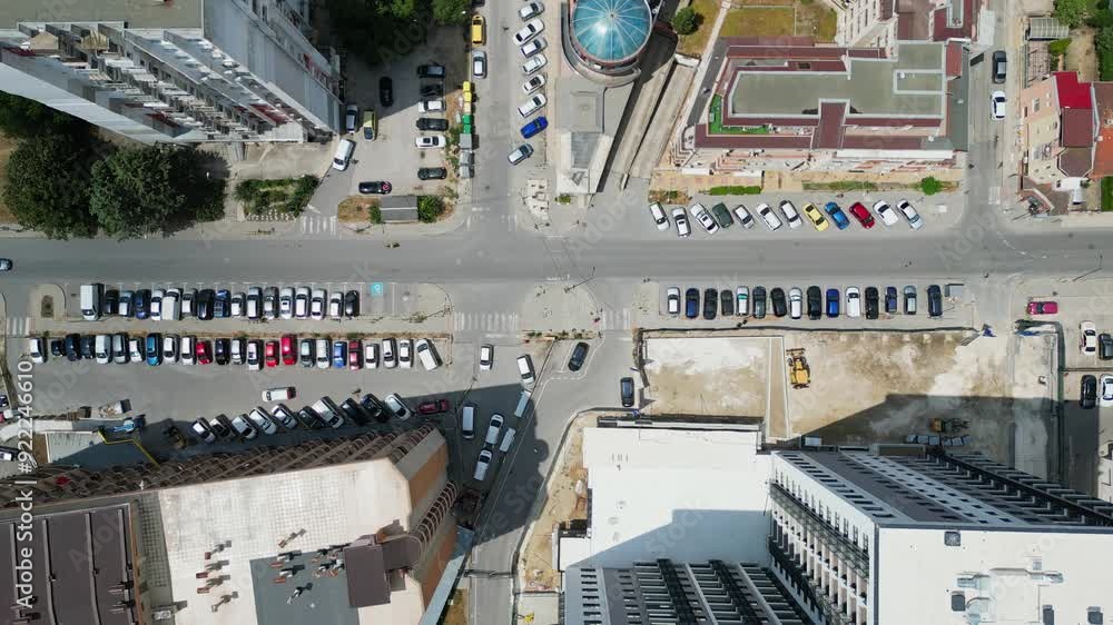 Top-down view of a city block with residential buildings, green spaces ...