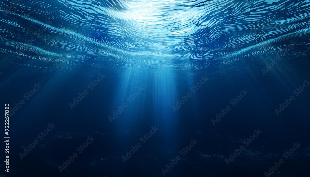 Deep blue undersea with sunlight ray through over surface ripple wave ...