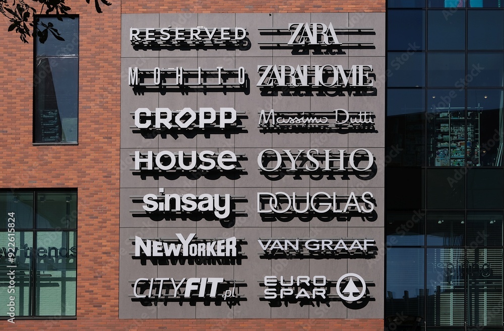 Gdansk, Poland - 14 August 2024: Store brand names on wall of Forum ...