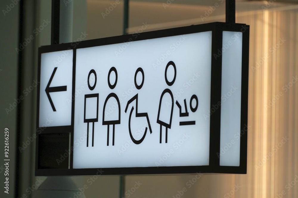 Illuminated toilet sign in a shopping center Stock Photo | Adobe Stock