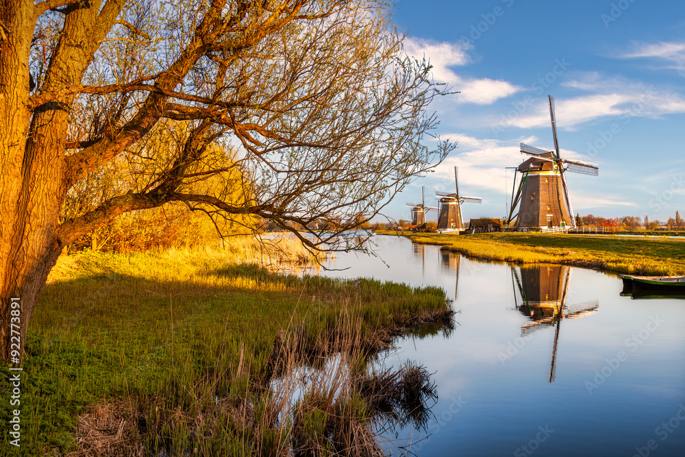 Dutch late afternoon at the 17th century Driemanspolder windmills, near ...