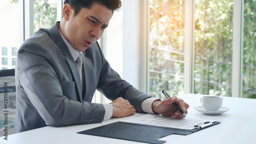 Asian businessman checking document upset disappointed wrong report ...