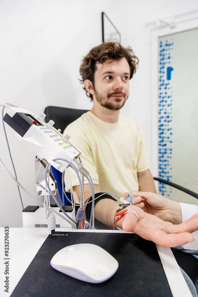 The patient undergoes an electromyography (EMG) test to assess nerve ...