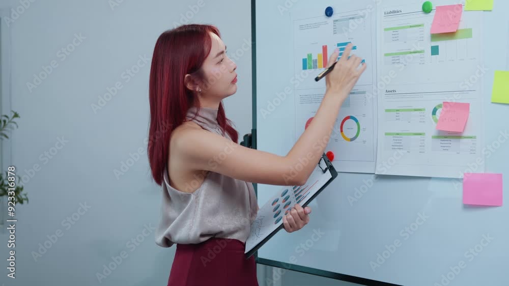Professional manager presenting data analysis to colleagues using a ...