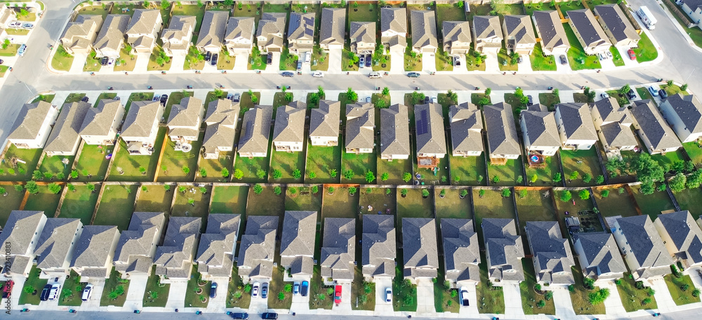 Row of new construction homes share same backyard fence boundary line ...