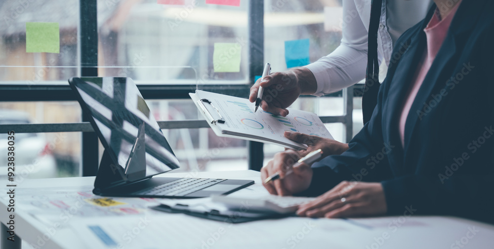 Collaborative Strategy: A close-up of two business professionals ...