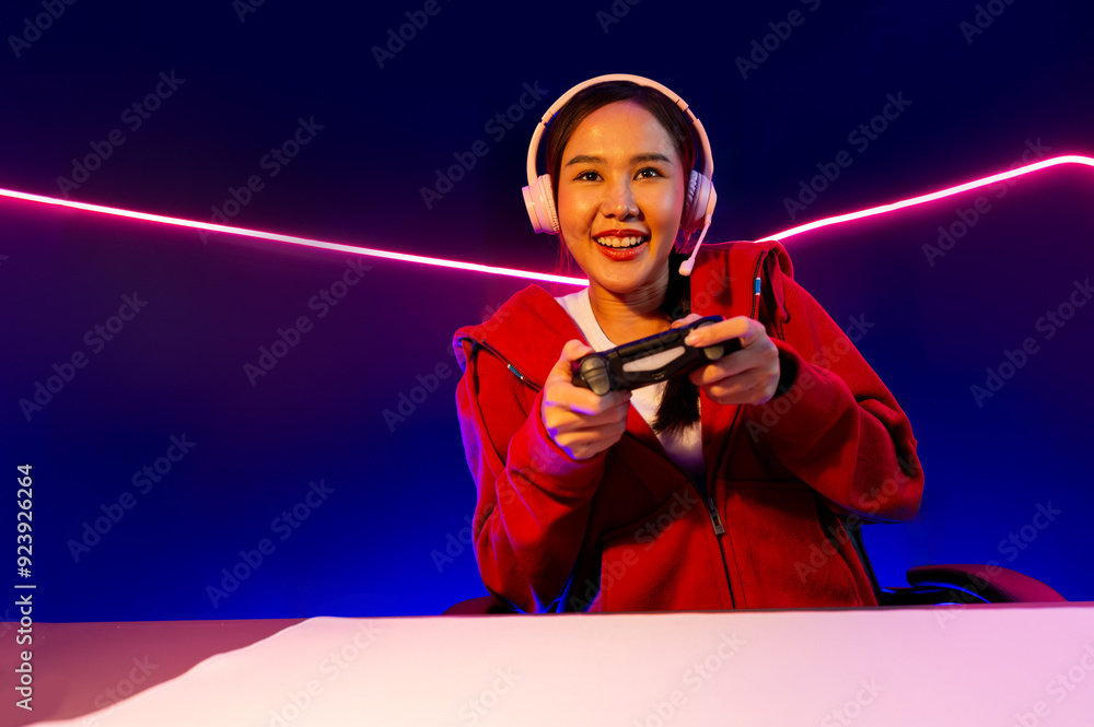Host channel of smiling beautiful Asian girl streamer with joystick ...