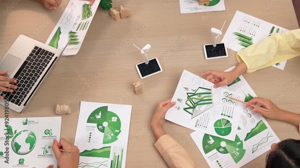 Excellent business team discussing on eco house project at meeting ...