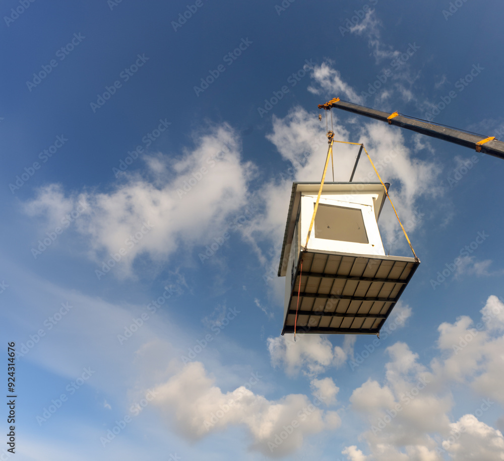 Raising part of a house in a modern knock-down house building process ...