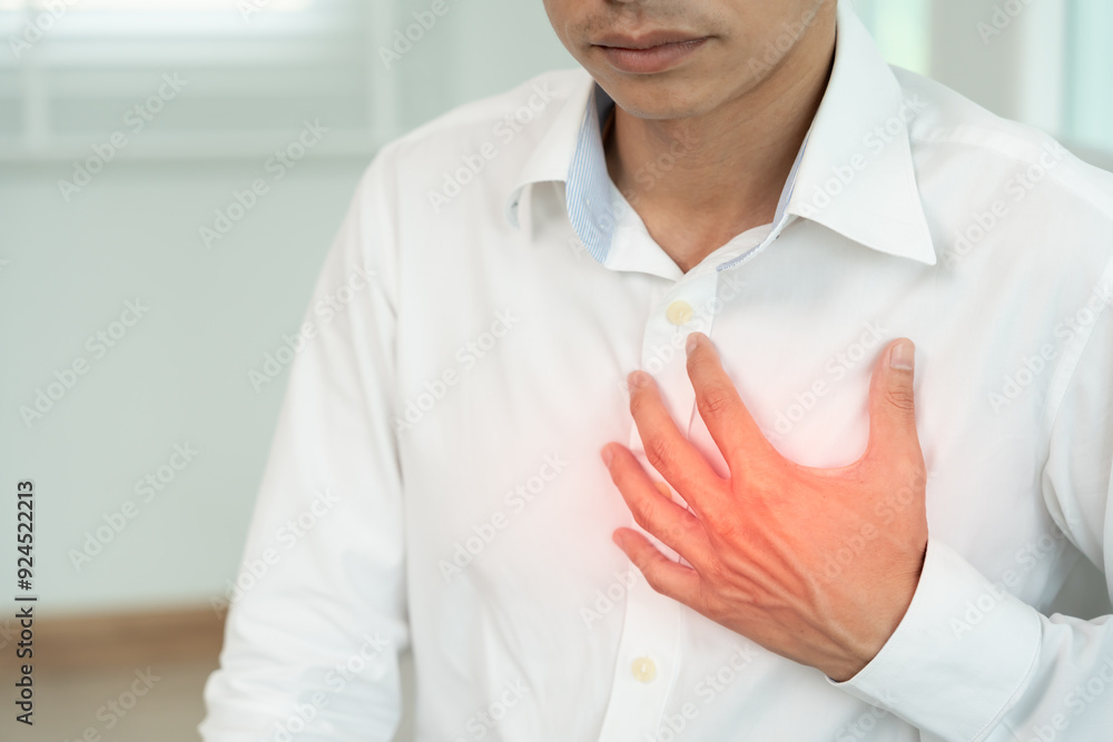 hand hold chest with heart attack symptoms, asian man working hard have ...