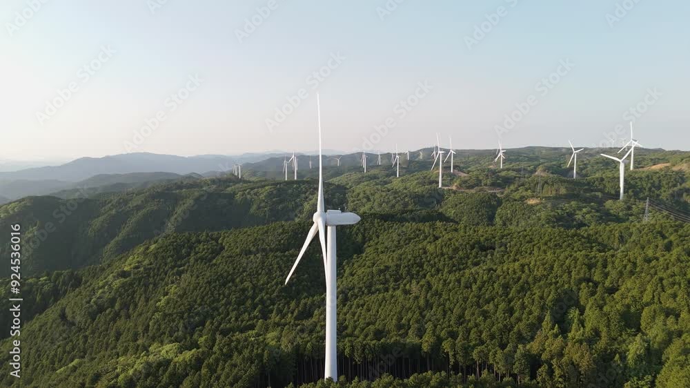 A cluster of wind turbines for generating electric power in a valley ...