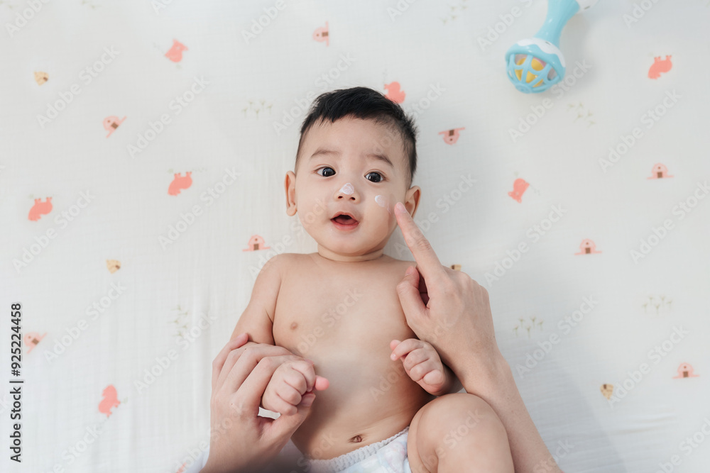 Happy Asian Baby with a Comfortable Smile, Mother Finger Gently ...