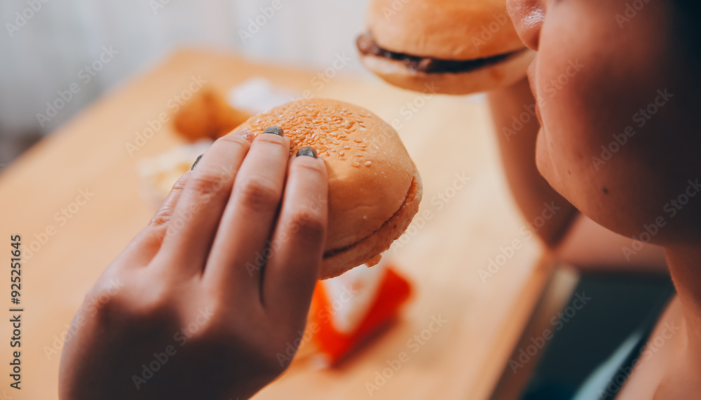 Binge eating disorder concept with woman eating fast food burger, fired ...
