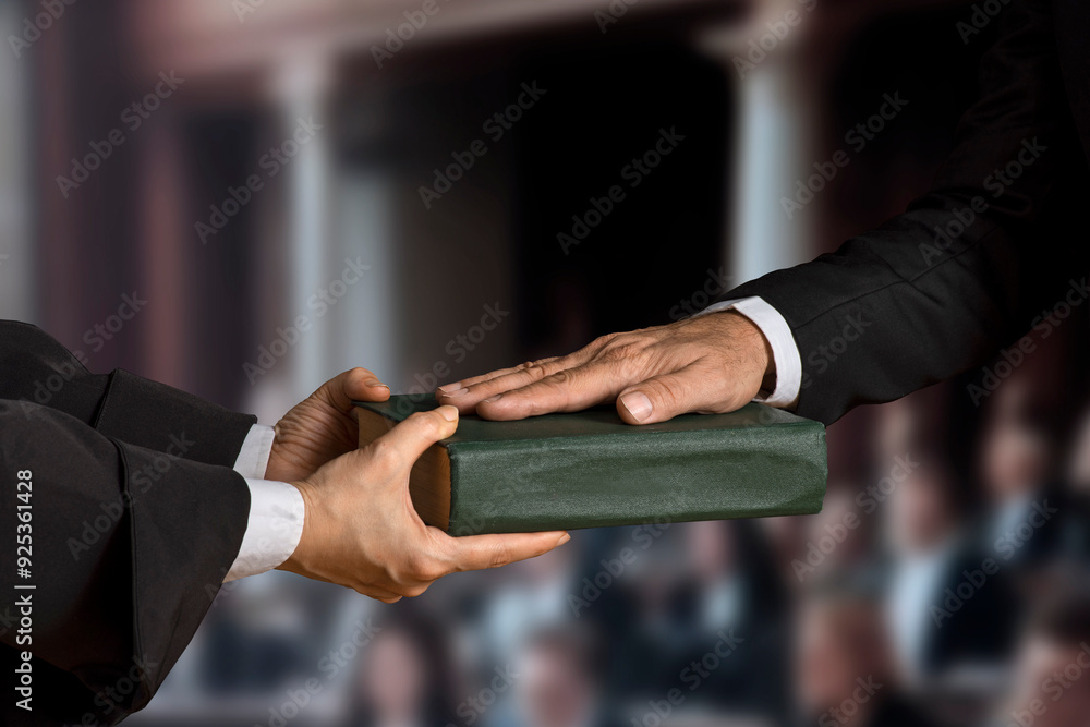 Hand on the Bible in court or the oath on the constitution book during ...
