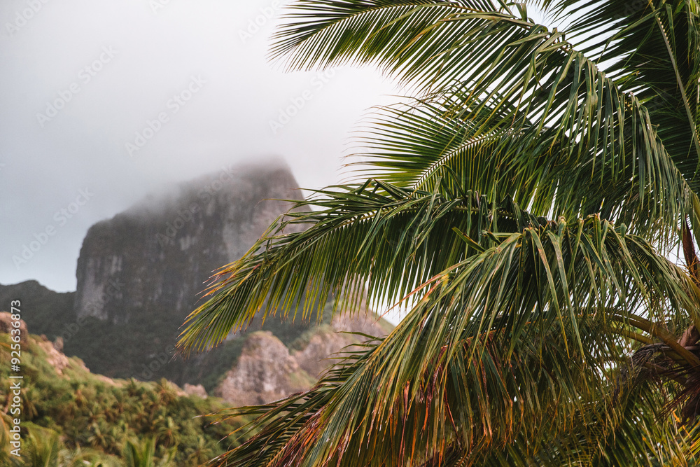 The extinct volcano Mt. Otemanu seen on Bora Bora island is covered in ...