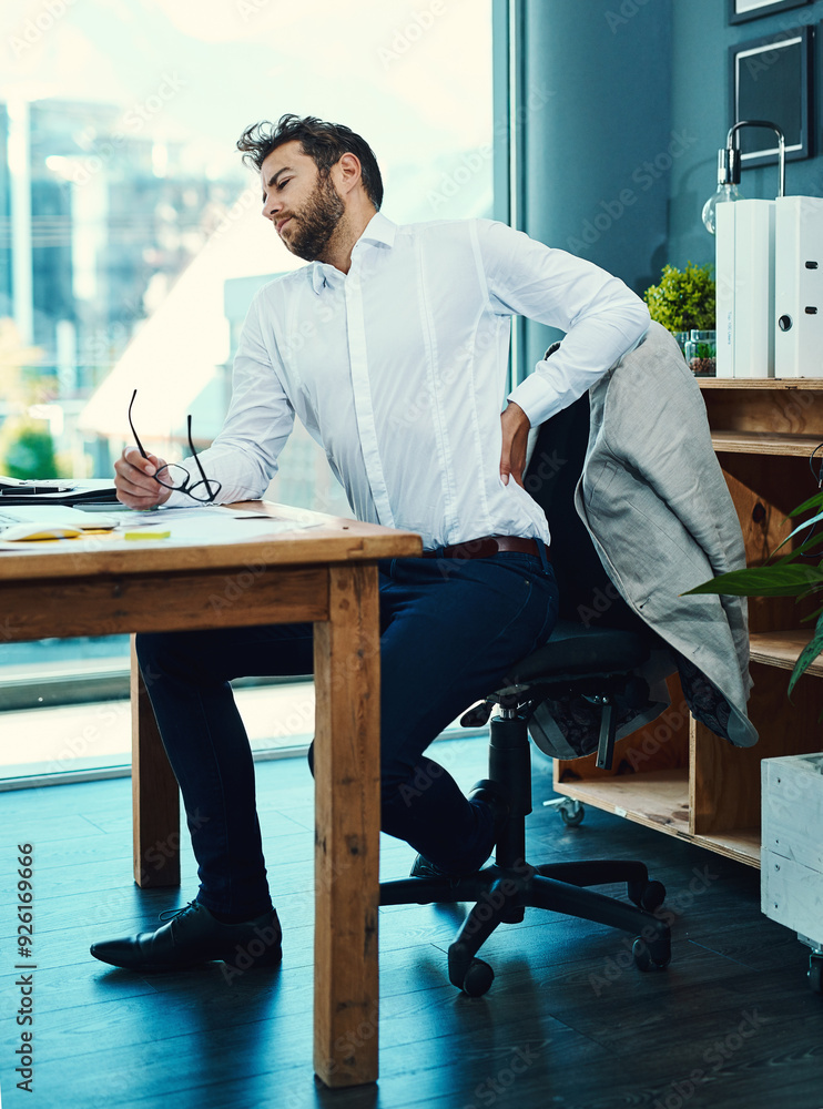 Frustrated businessman, back injury and desk with pain from accident ...