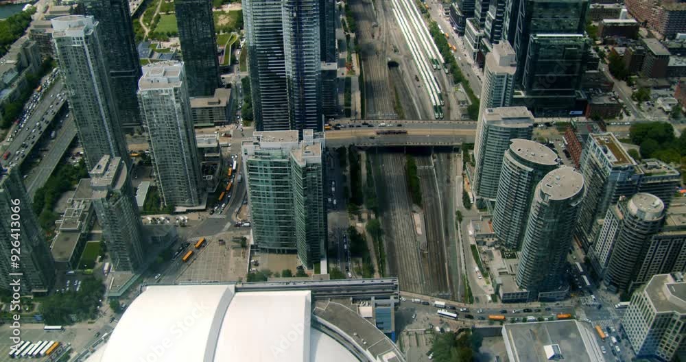 Breathtaking aerial perspective of downtown Toronto and a stadium alive ...