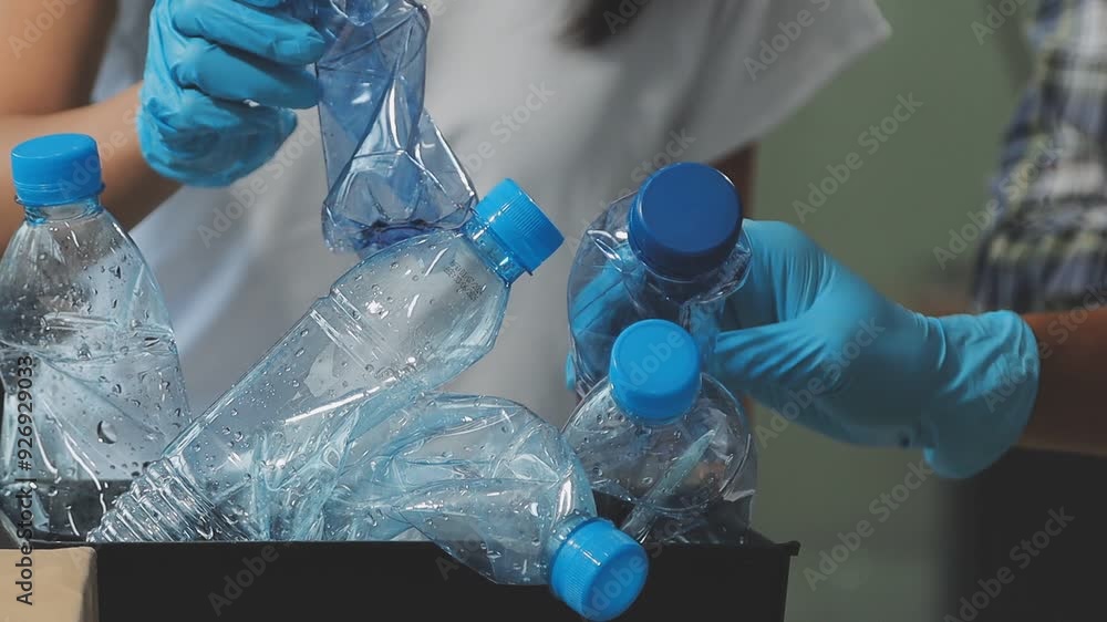 Garbage separation concept. Female hands separate paper and plastic ...