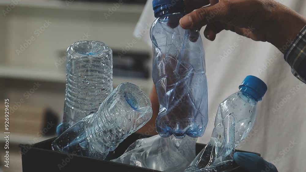 Garbage separation concept. Female hands separate paper and plastic ...