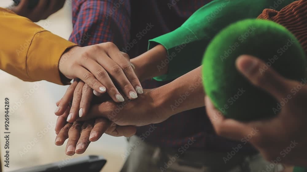Close up mixed race business people putting hands together, support and ...