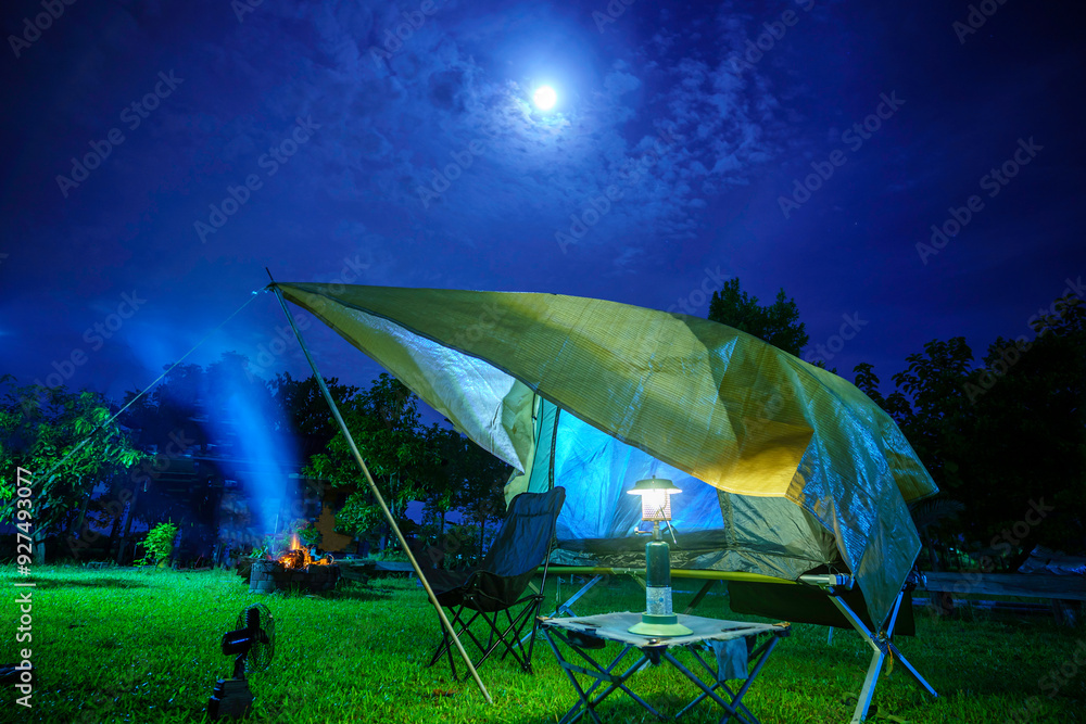 Camping tents at night in a forest Sky background with the moon ...