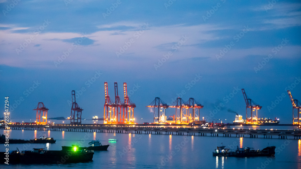 Logistic shipping quay boat in twilight sky night Engineering crane ...