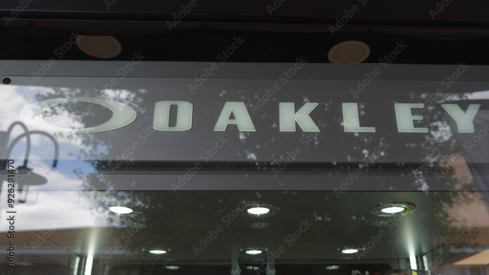 oakley facade shop brand logo and sign text in windows optical store ...