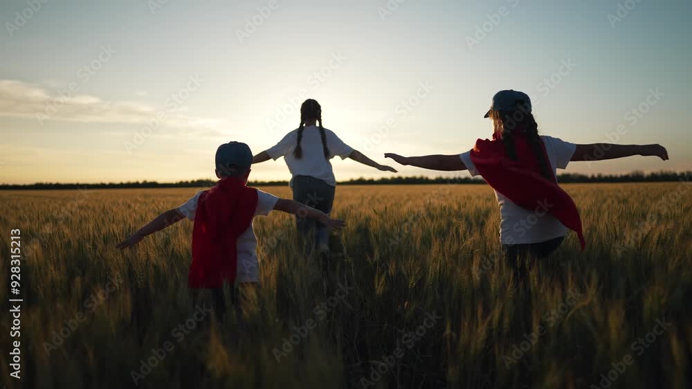 Happy family running in field. Kids in superhero capes playing. Family ...