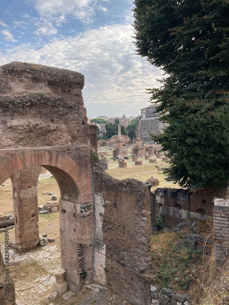 Explore the iconic Roman rounded archway and scattered artifacts in the ...