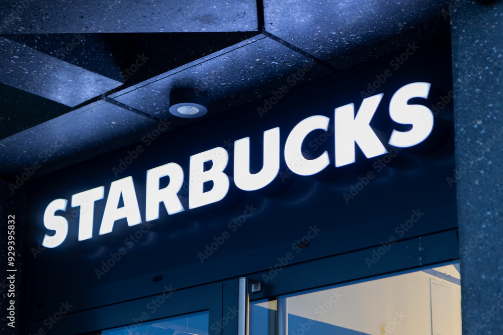 Poznan, Poland. 13 August, 2024: Illuminated Starbucks Storefront Sign ...