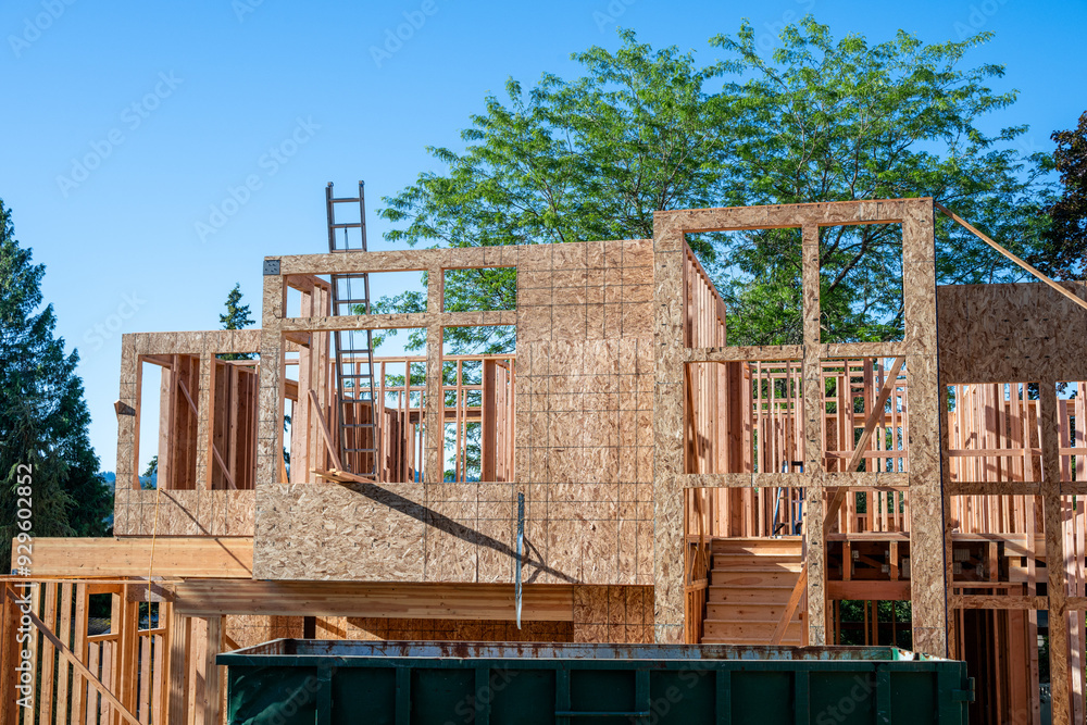 Summer construction season, two story new house build in progress at ...