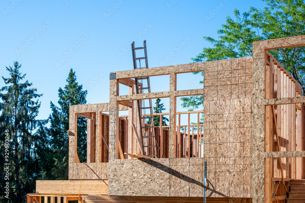 Summer construction season, new house build at the framing stage ...
