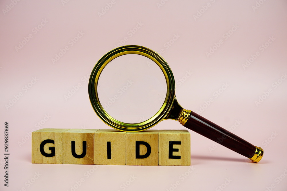 Guide with wooden blocks alphabet letters and Magnifying glass on pink ...