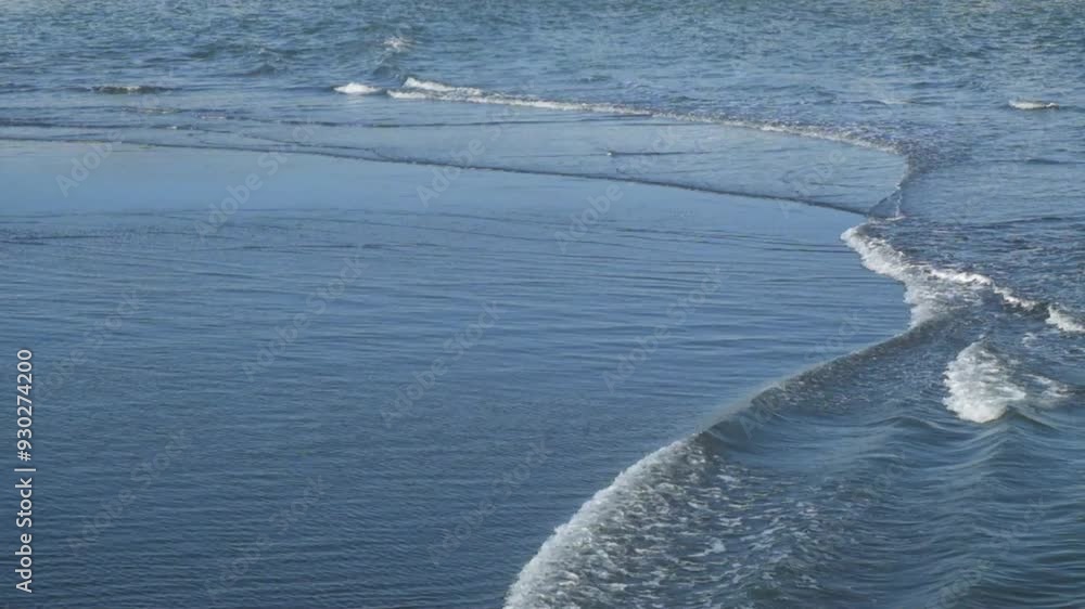 Abstract patterns, shapes and textures of sea wave movements on beach ...