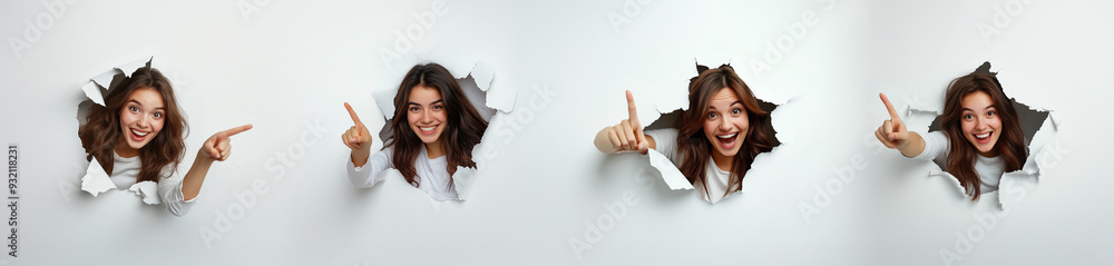 Junge Frau steckt den Kopf durch ein Loch in der Wand und zeigt freudig ...