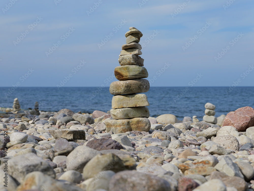 Stacked stones to form towers and figures on the beach are popular ...