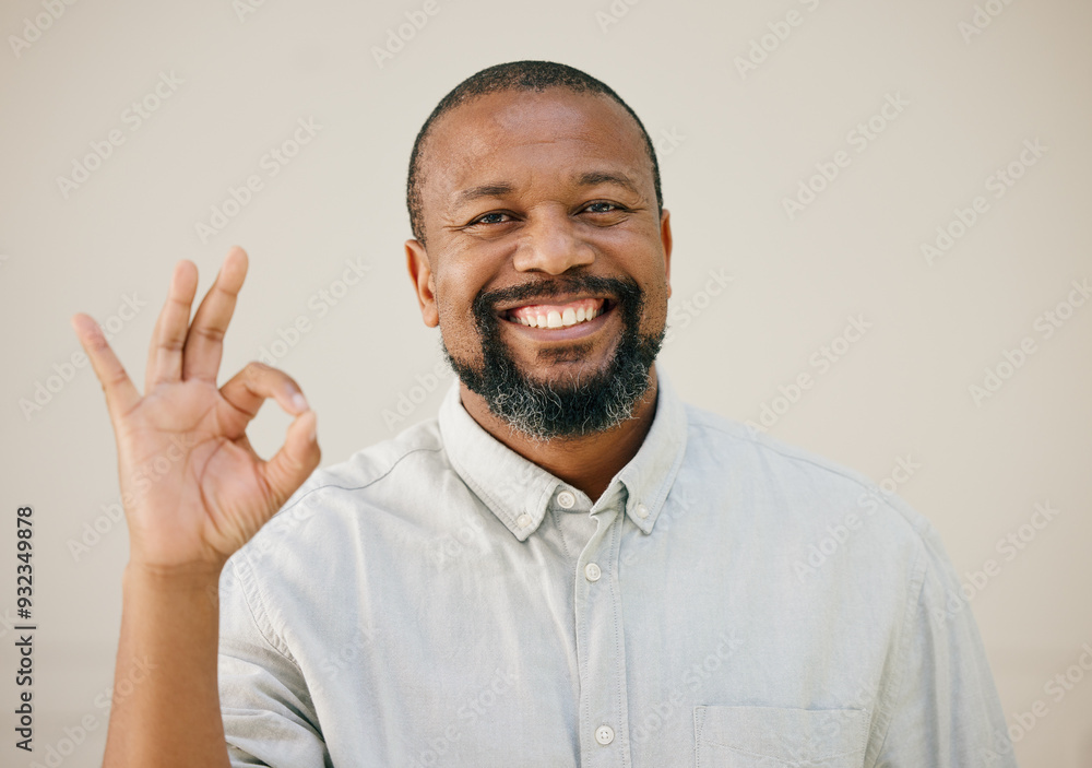 Portrait, happy and black man with ok sign in studio background for ...