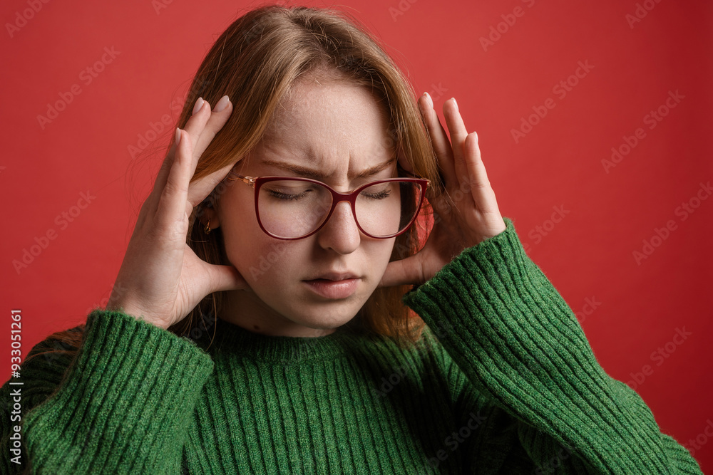 severe headache, brain spasm, portrait of a girl with glasses squeezing ...