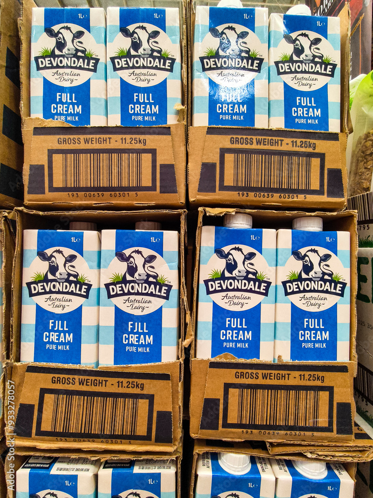 Devondale full cream milk cartons stacked in a supermarket shelf Stock ...