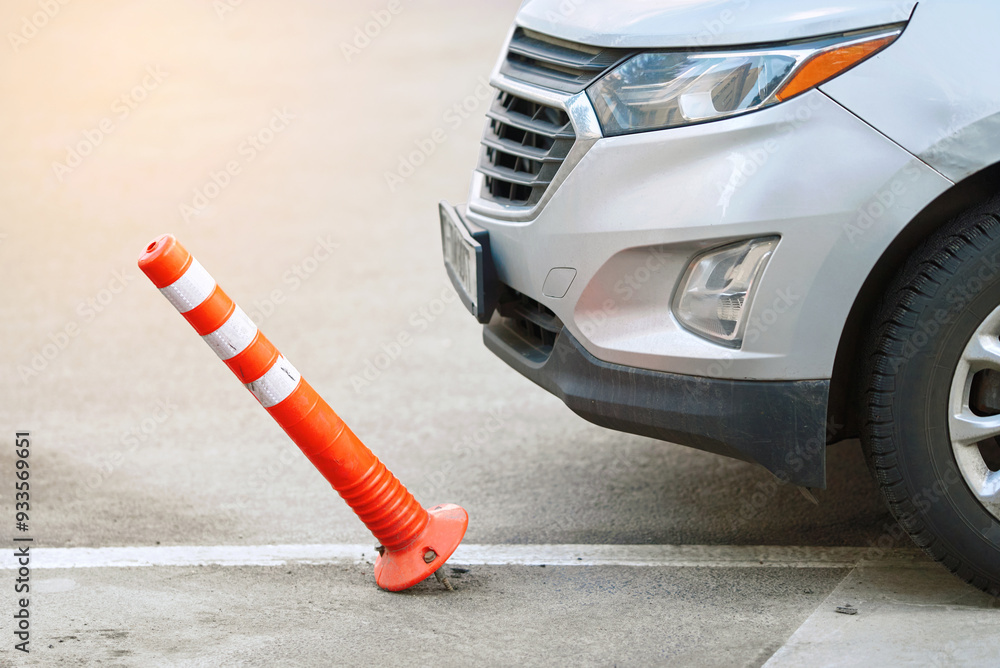 Car hits bollard in parking lot, bent pole with torn out fastening. Car ...