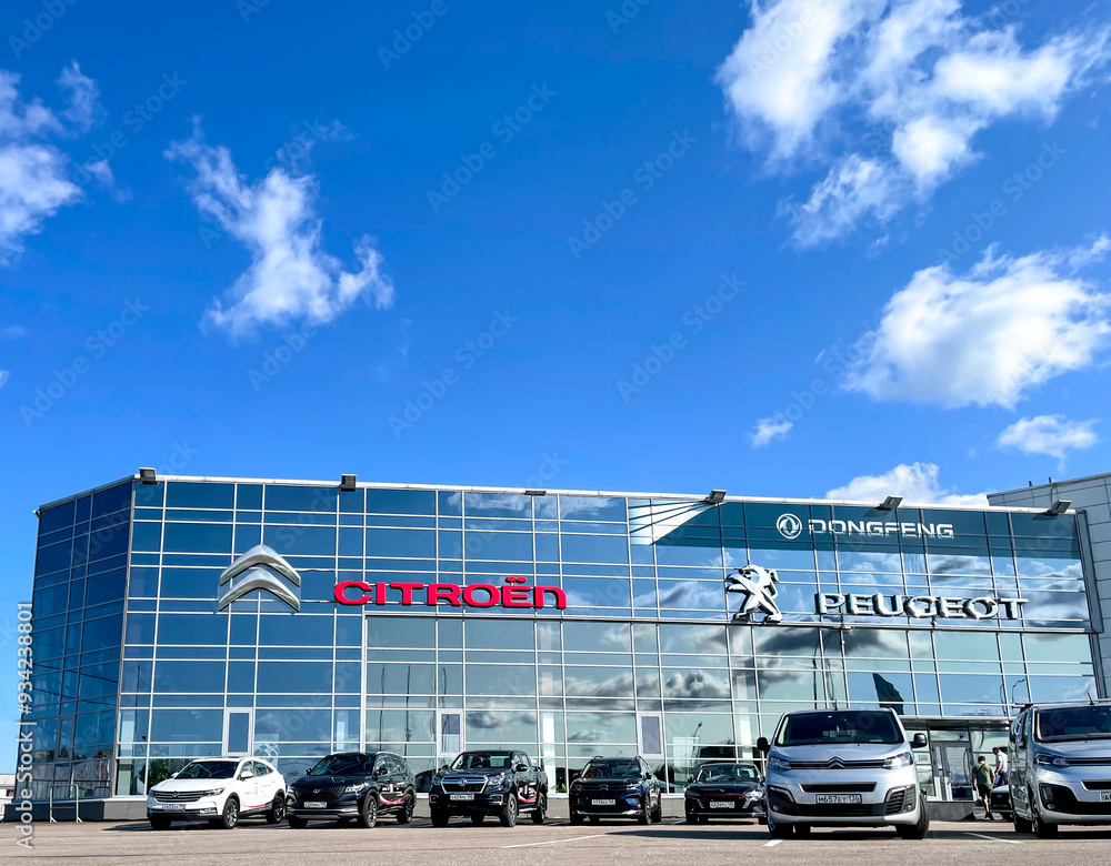 Citroen sign on glass facade of dealership building. Citroen logo and ...