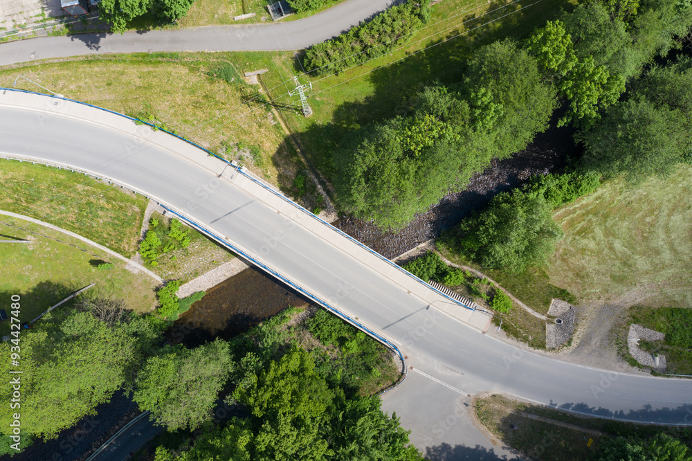 Reinforced concrete road bridge over the river. Close-up during sunny ...