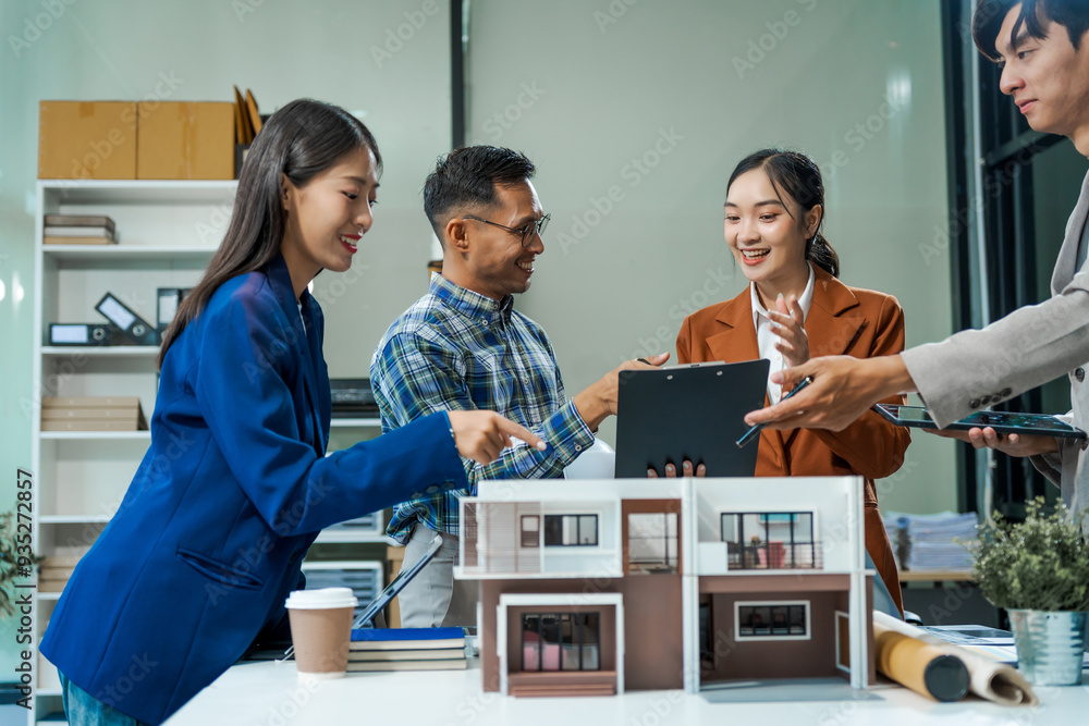 In an office room, architect-engineer team discusses modern house model ...