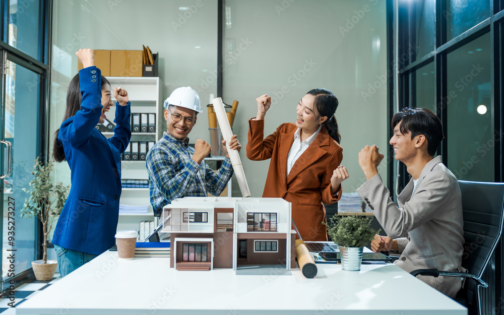 In an office room, architect-engineer team discusses modern house model ...