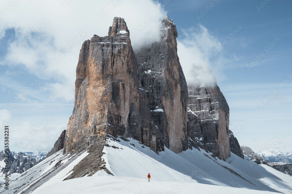 Girl standing in fronnt of a huge mountain in the Italian Alps, The ...