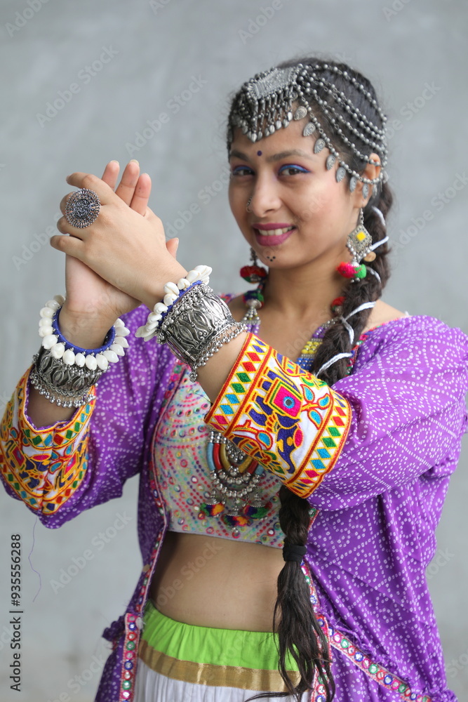 woman wearing chaniya choli shrug and oxidized jewellery for garba and ...
