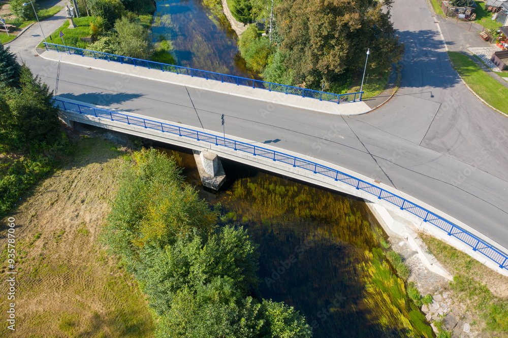 Reinforced concrete road bridge over the river. Close-up during sunny ...