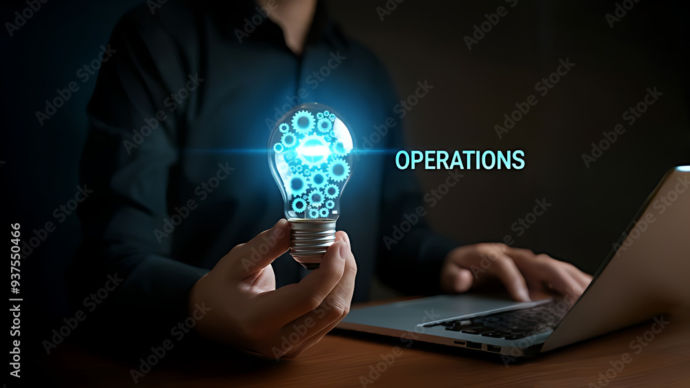 Operational concept. Businessman holding light bulb with operation icon ...