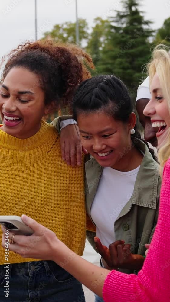 Vertical. Laughing Caucasian woman talking and using mobile in circle ...