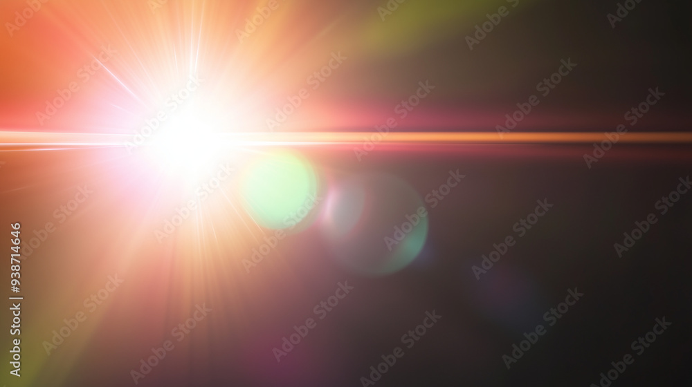 Abstract light lens flare with colorful halos on a blurred black ...
